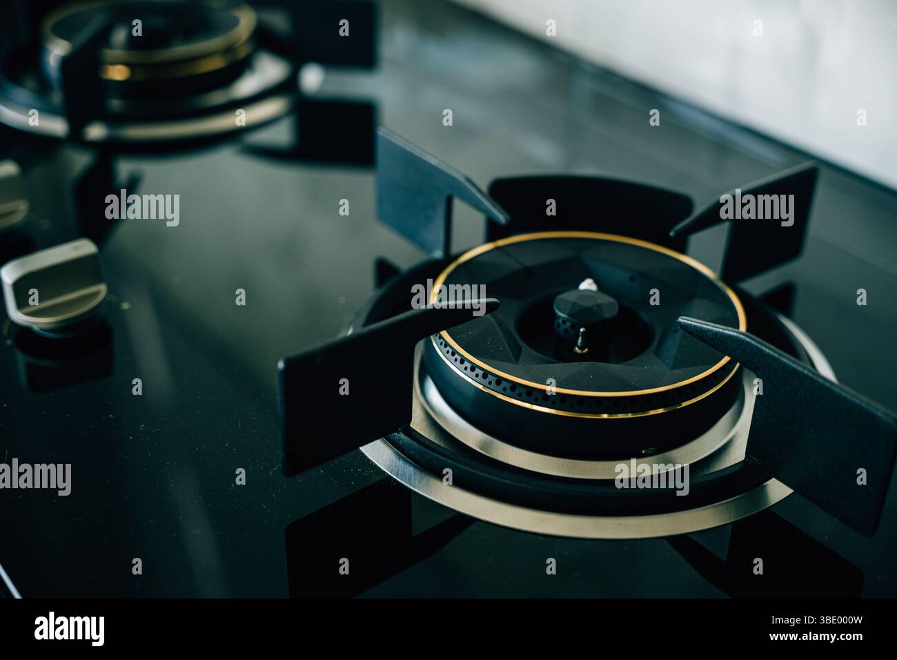 Elegant black and gold gas stove a luxurious centerpiece for high-end ...