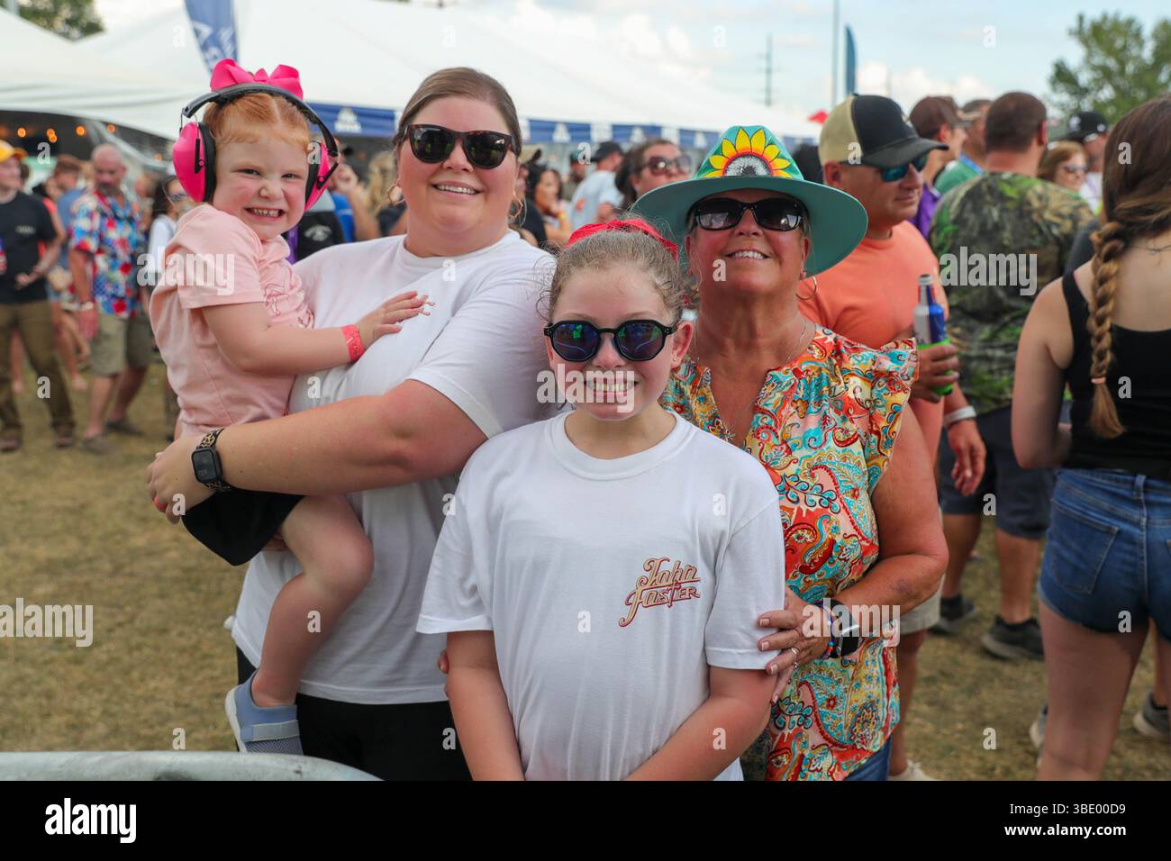 Denham Springs, LA, USA. 25th May, 2025. A family takes in the music ...