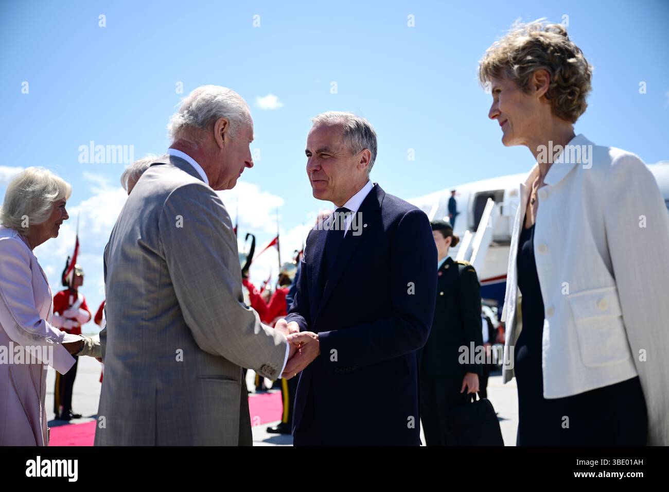 King Charles III is greeted by Canadian Prime Minister Mark Carney and ...