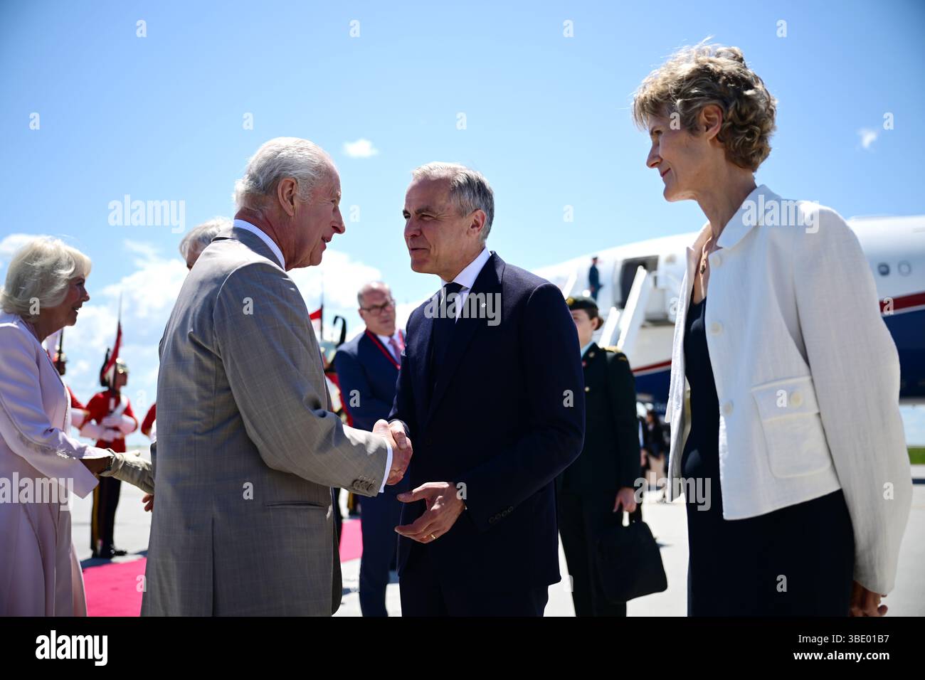 King Charles III is greeted by Canadian Prime Minister Mark Carney and ...