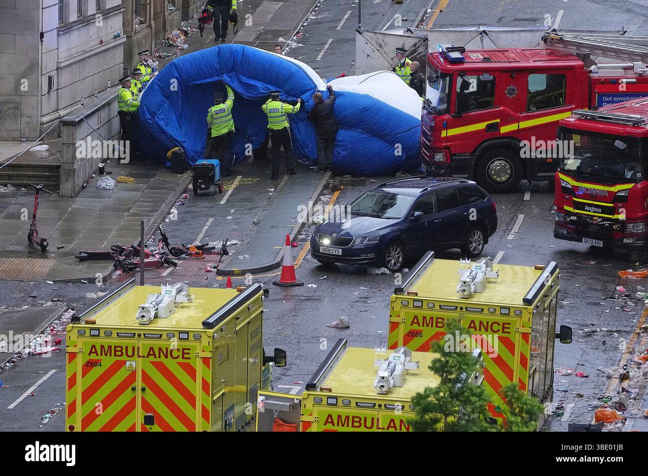 Police and emergency personnel deal with an incident after a car ...