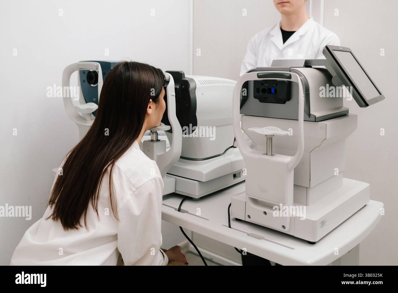 Eye exam with modern autorefractor and OCT machines. Autorefractor ...