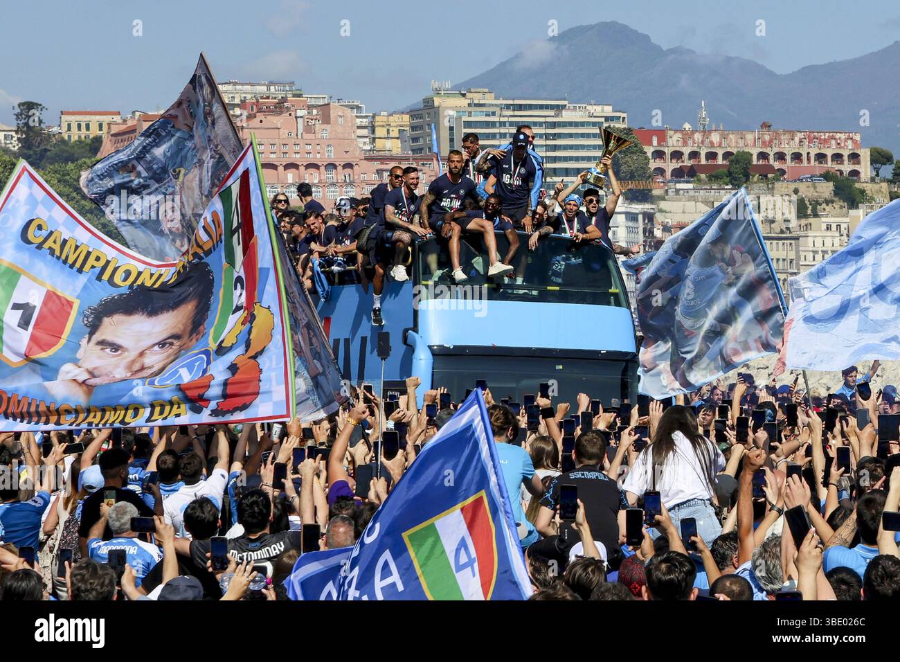 Naples, Italy. 26th May, 2025. Napoli players greet fans from atop a ...