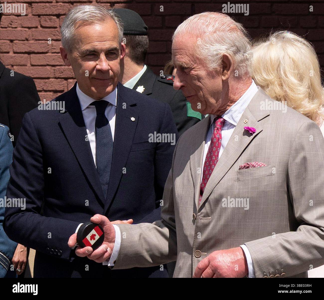 Ottawa, Canada. 26th May, 2025. Prime Minister Mark Carney looks on as ...