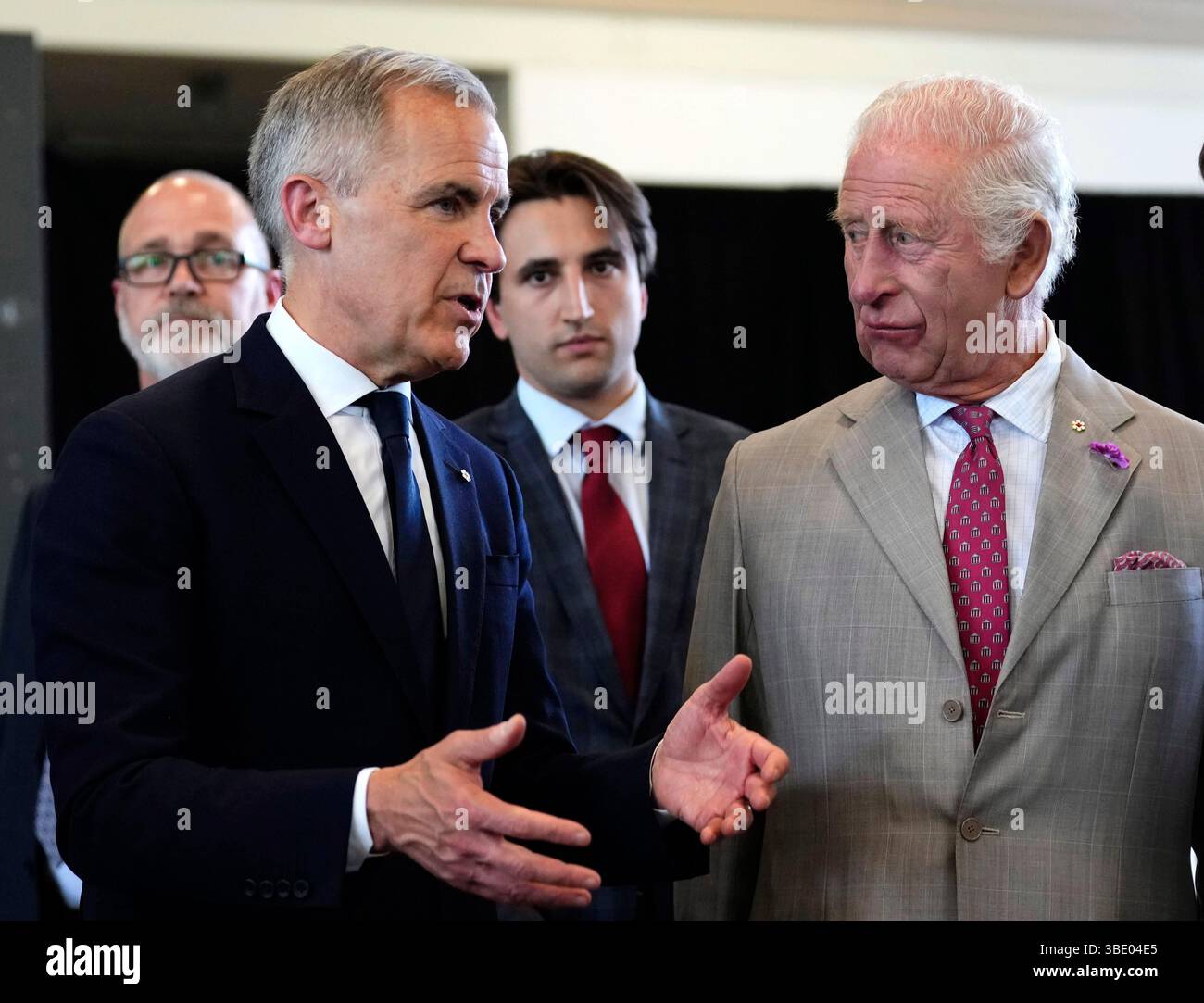 Canada Prime Minister Mark Carney speaks with King Charles as they ...