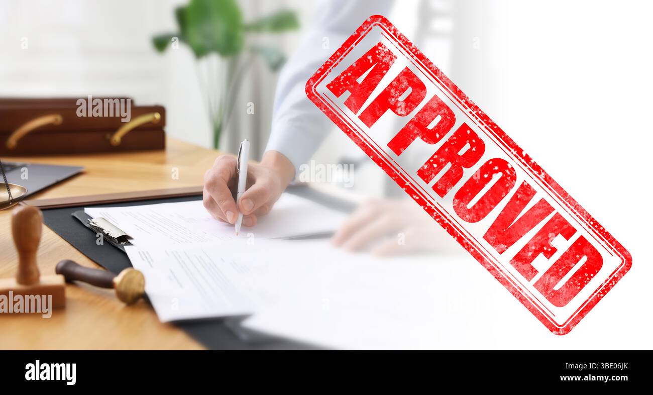 Man signing document at table in office and red stamp Approved, banner ...