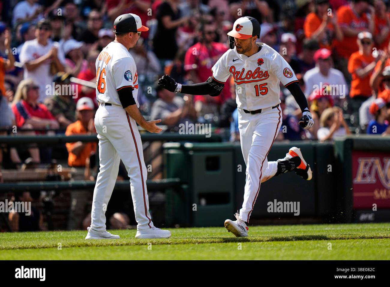 Baltimore Orioles' Dylan Carlson (15) celebrates with interim third ...