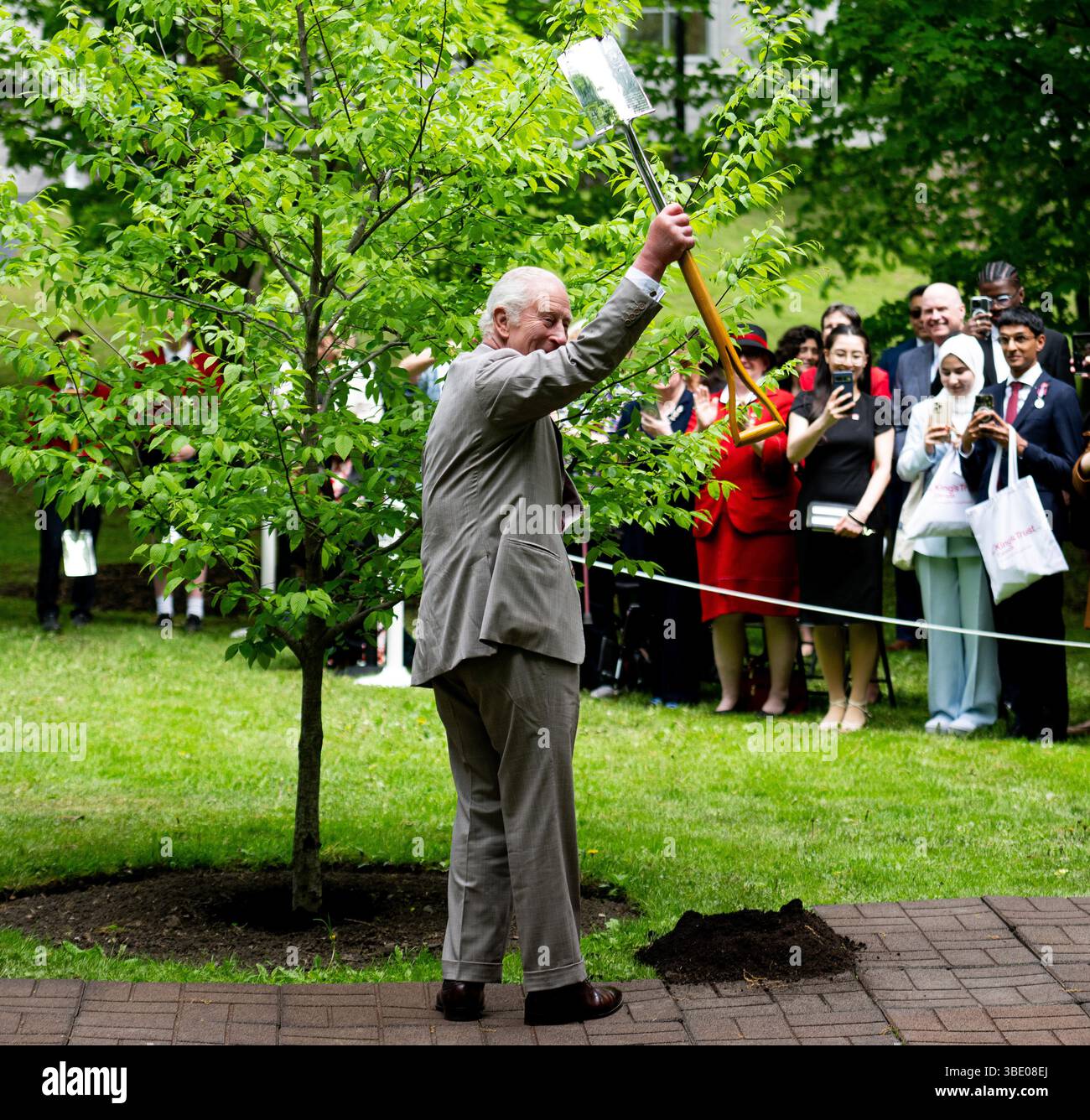 Ottawa, Canada. 26th May, 2025. King Charles waves a shovel used during ...
