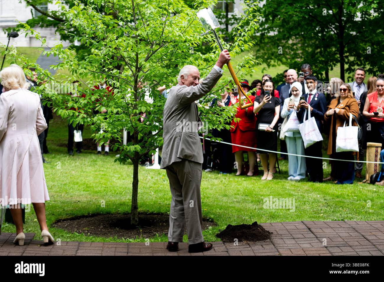Ottawa, Canada. 26th May, 2025. King Charles waves a shovel used during ...