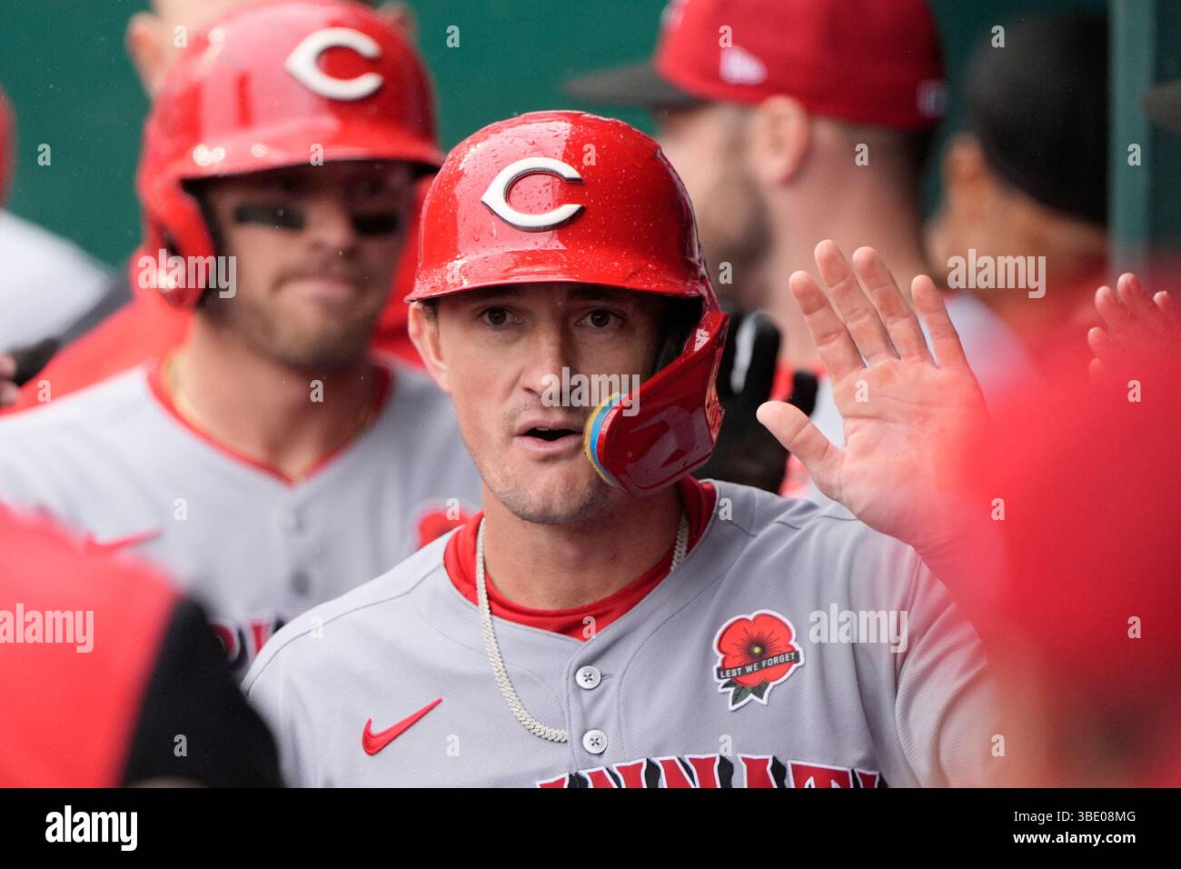 Cincinnati Reds' Austin Hays celebrates in the dugout after hitting a ...