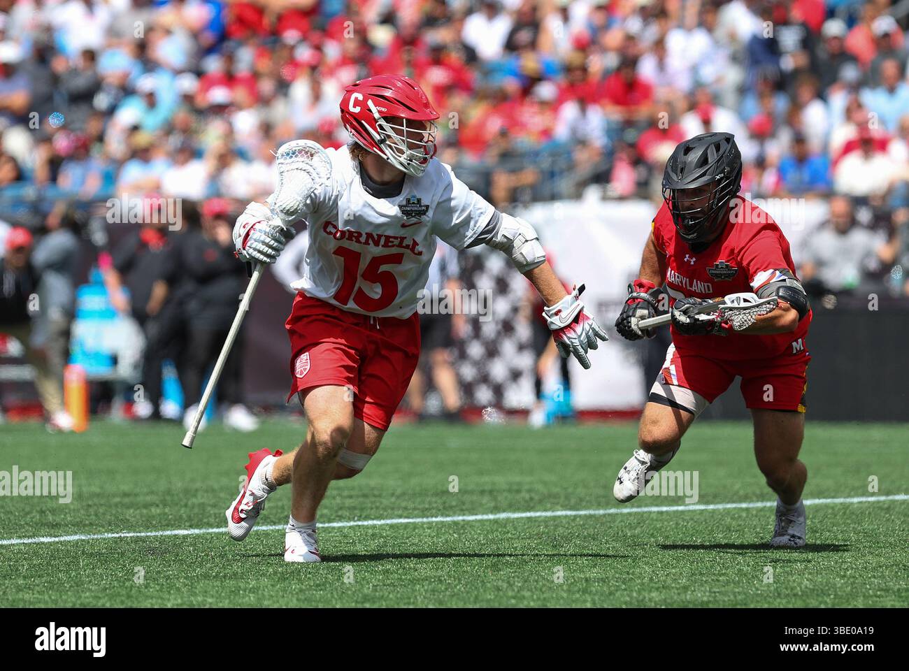 FOXBOROUGH, MA - MAY 26: CJ Kirst (15) of Cornell Big Red pursued by AJ ...