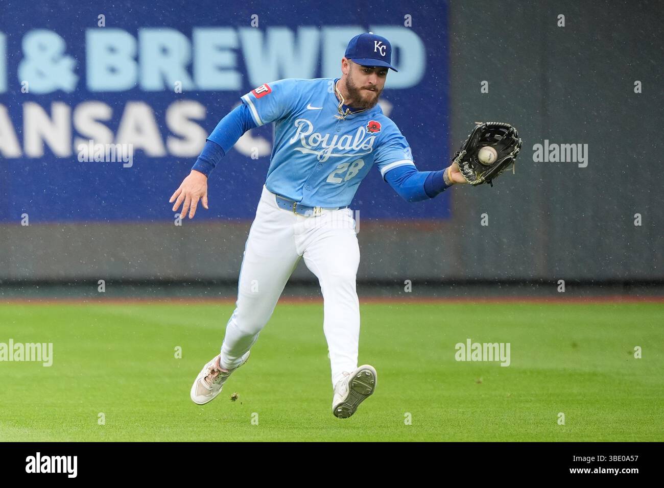 Kansas City Royals center fielder Kyle Isbel fields an RBI single hit ...