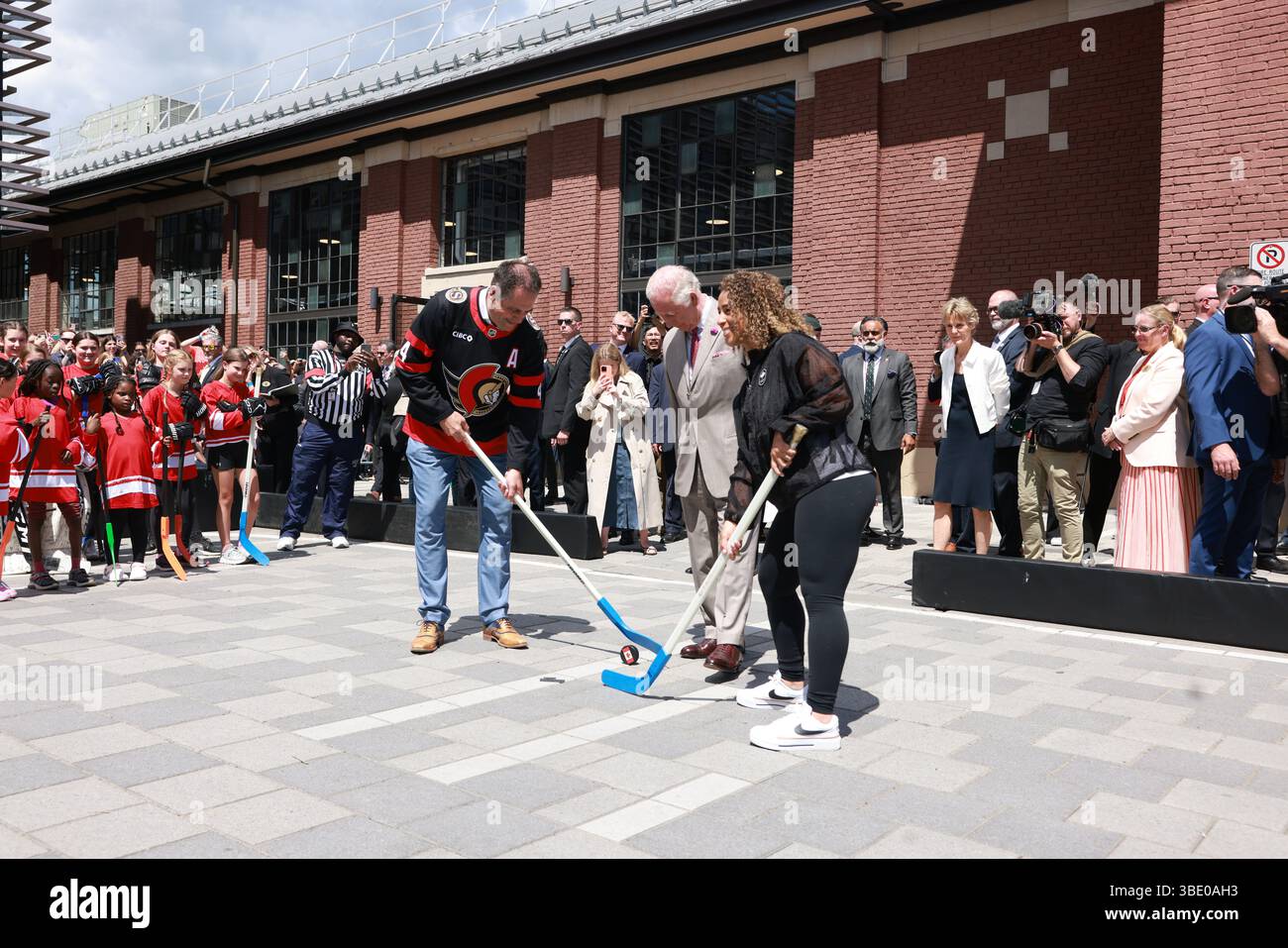 King Charles III puts down the puck for the start of a game of hockey ...