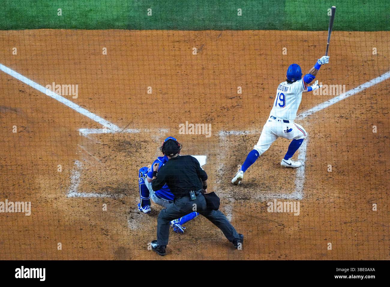 Texas Rangers' Alejandro Osuna (19) watches his ball as he collects his ...