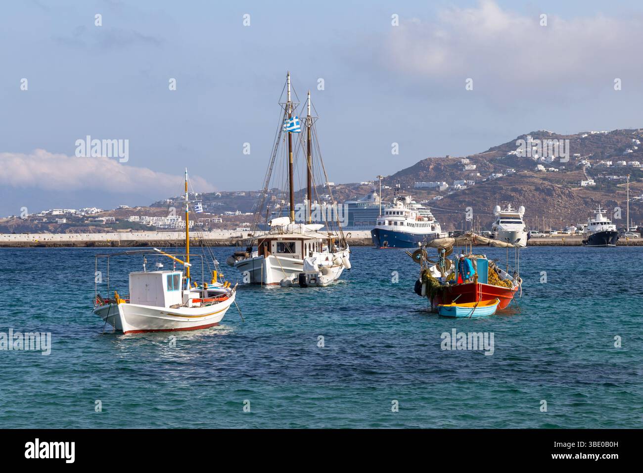 Mykonos, Greece - May 23rd 2018: Fishing boats bob in the Aegean Sea ...
