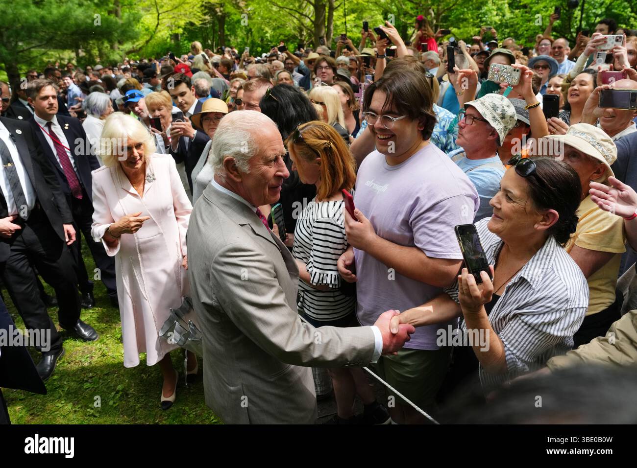 Ottawa, Canada. 26th May, 2025. King Charles and Queen Camilla greet people as they walk towards ...