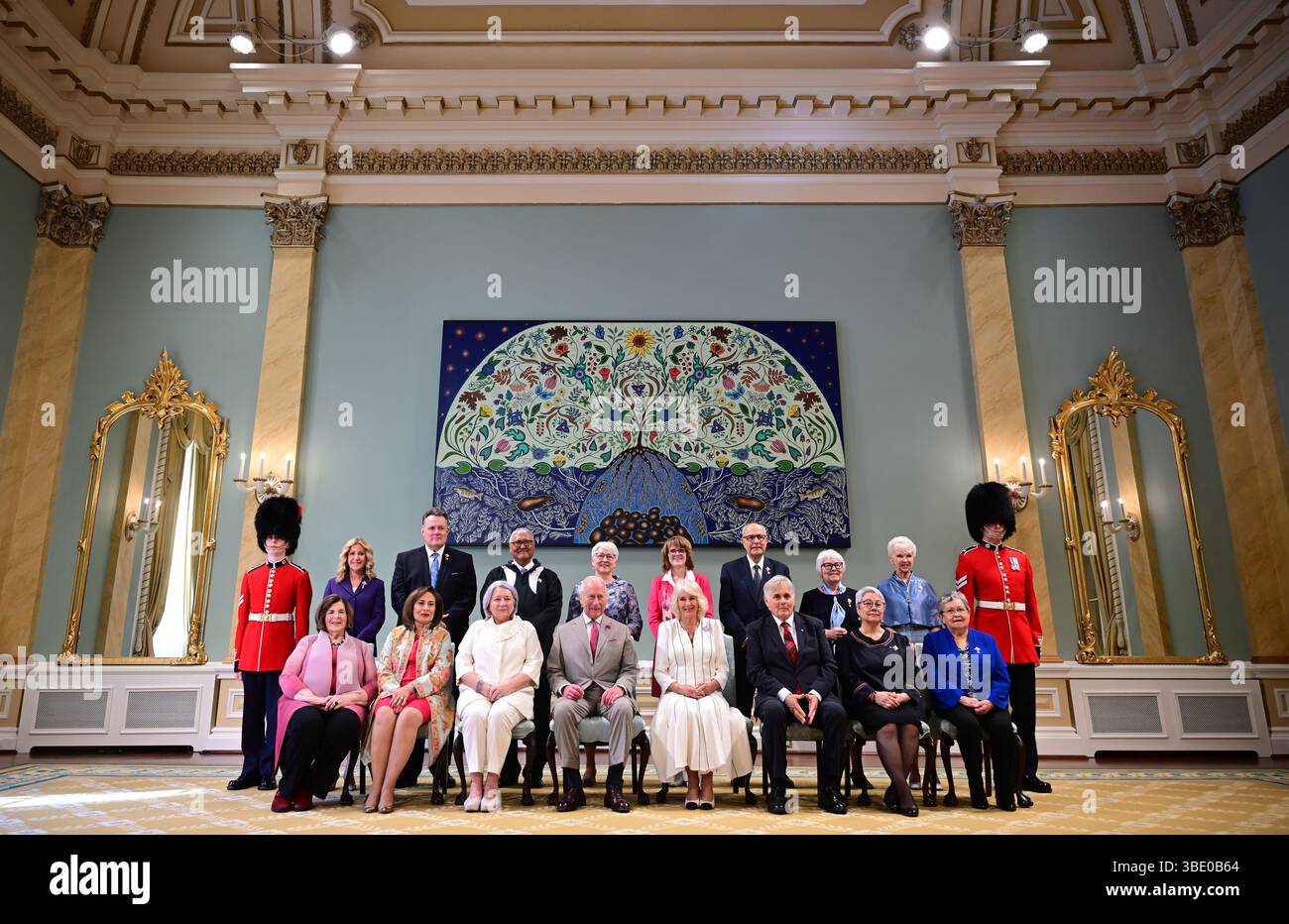 King Charles III and Queen Camilla pose for a photo with the holds an ...