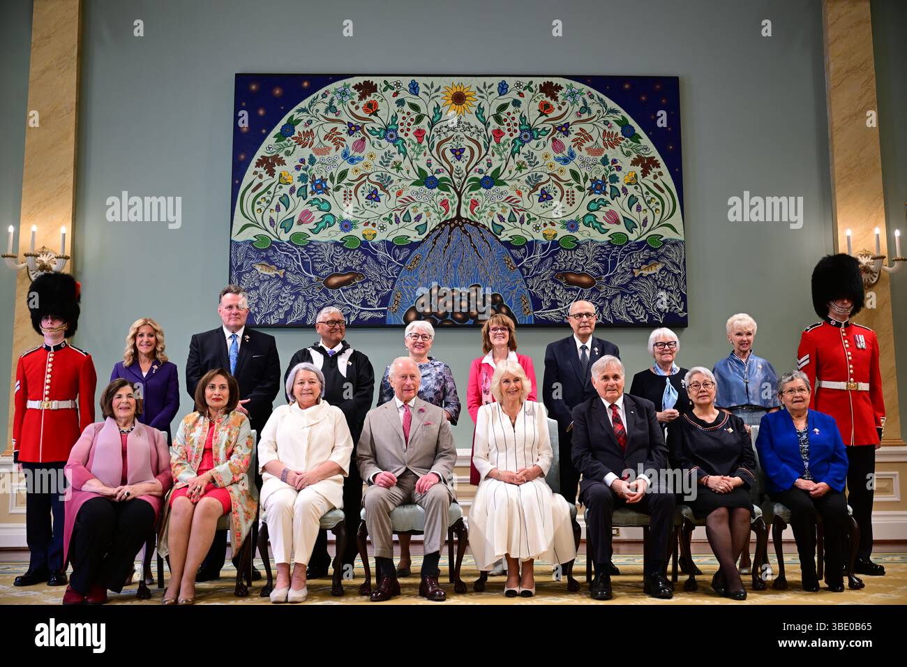 King Charles III and Queen Camilla pose for a photo with the holds an ...