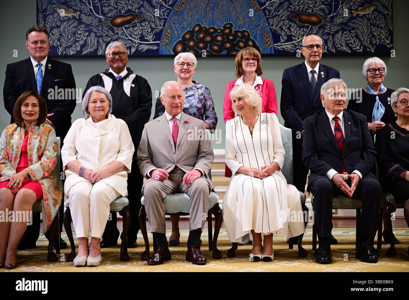 King Charles III and Queen Camilla pose for a photo with the holds an ...