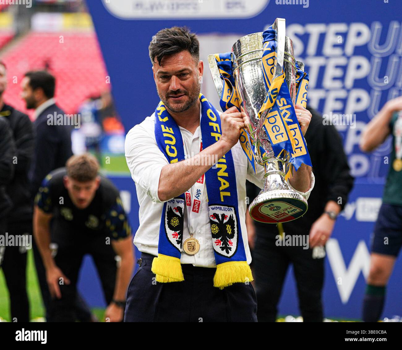 Johnnie Jackson manager of AFC Wimbledon celebrating after the Sky Bet ...
