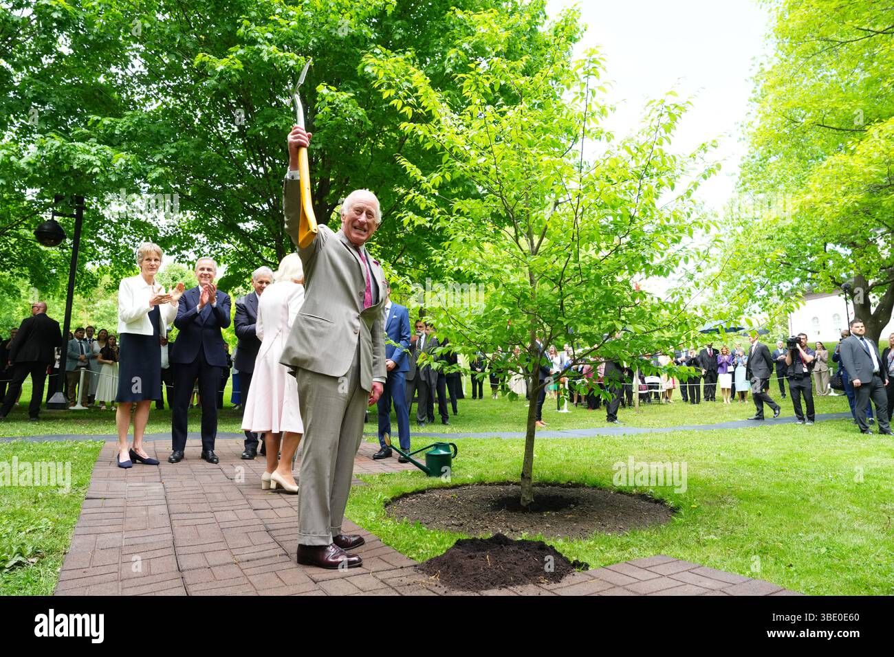 Ottawa, Canada. 26th May, 2025. King Charles takes part in a tree ...