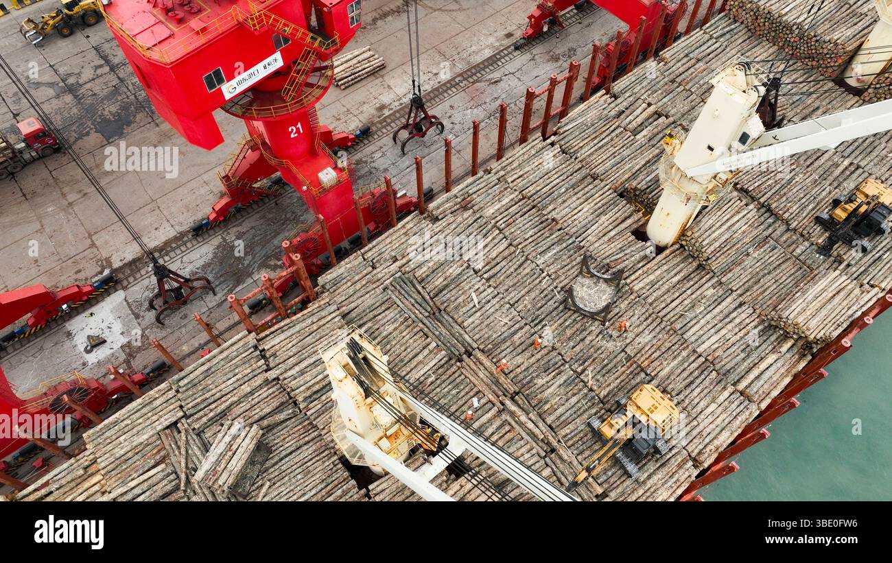 RIZHAO, CHINA - MAY 23, 2025 - A cargo ship is conducting an automated ...