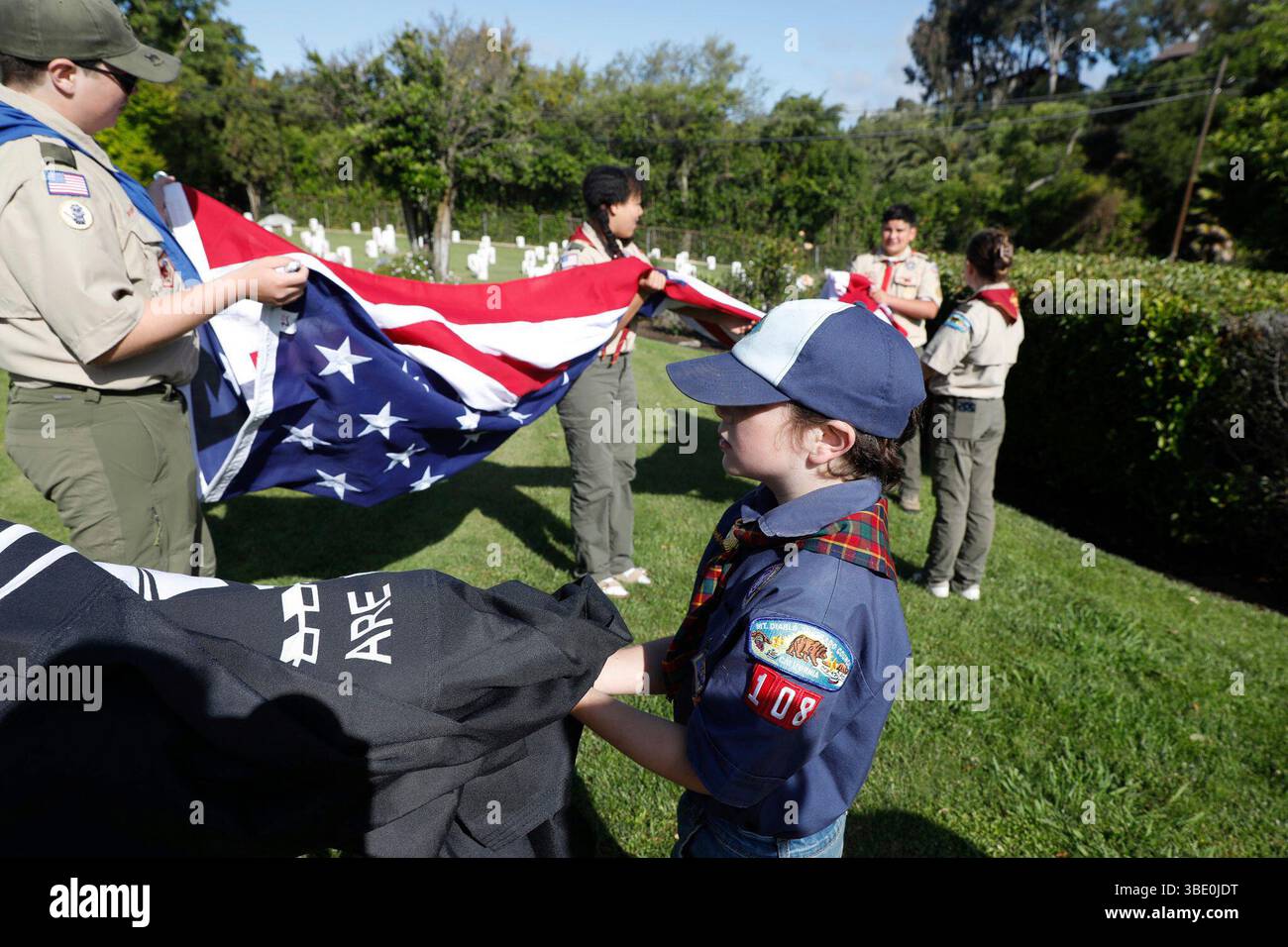 Members of Scouting America and Scouts BSA work together as they they ...