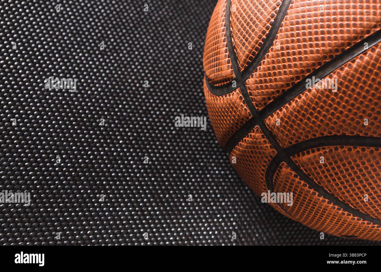 Old basketball ball on black background copy space Stock Photo - Alamy