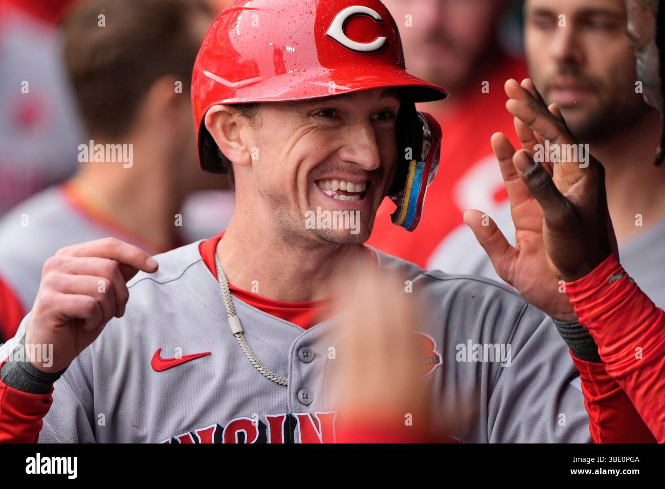 Cincinnati Reds' Austin Hays celebrates in the dugout after scoring on ...