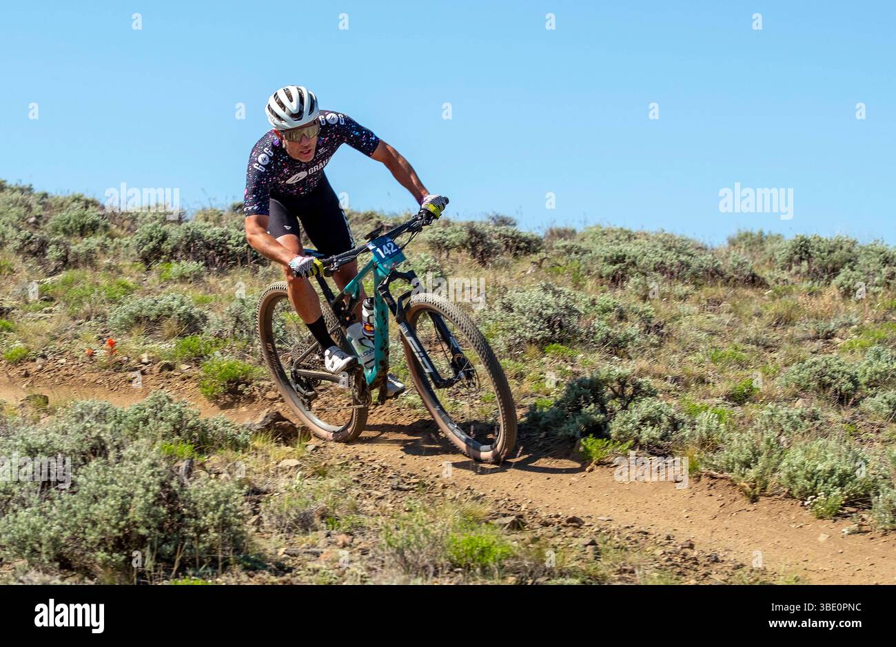 May 25, 2025. Mountain bike cyclists crosses through high desert ...