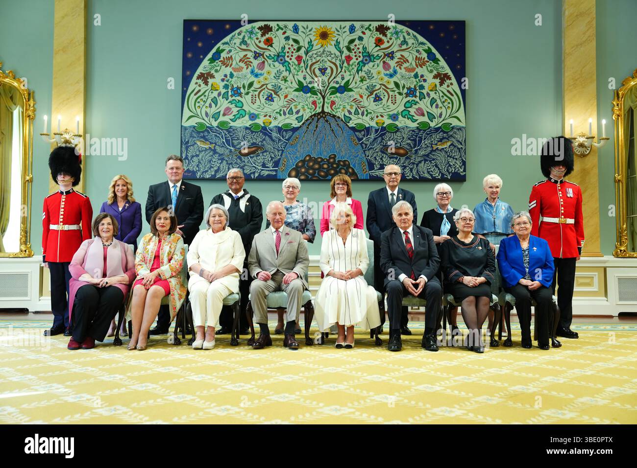 King Charles and Queen Camilla, front centre, pose for a photo with Gov ...