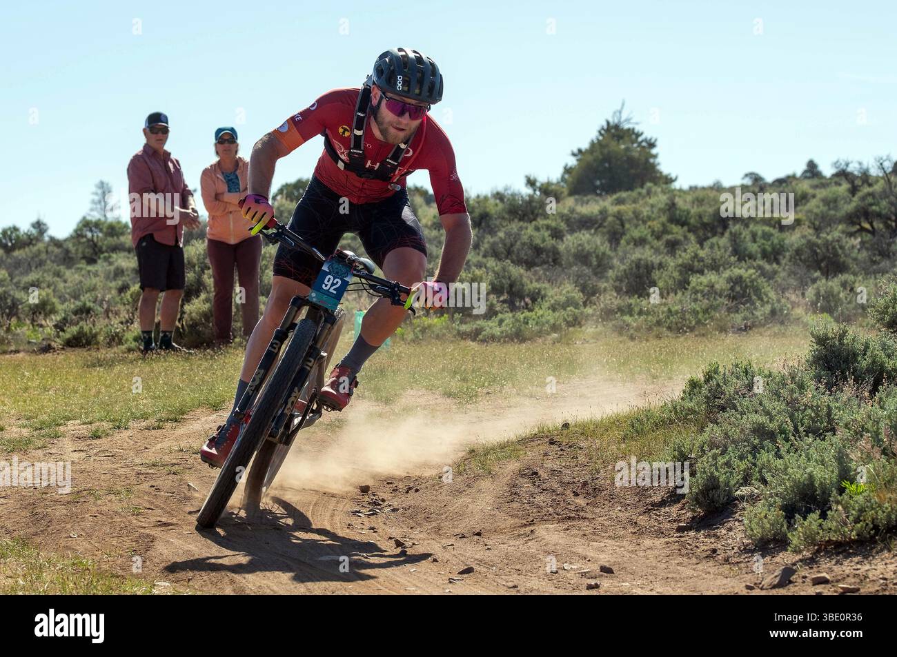 May 25, 2025. Mountain bike cyclist crosses through high desert terrain ...