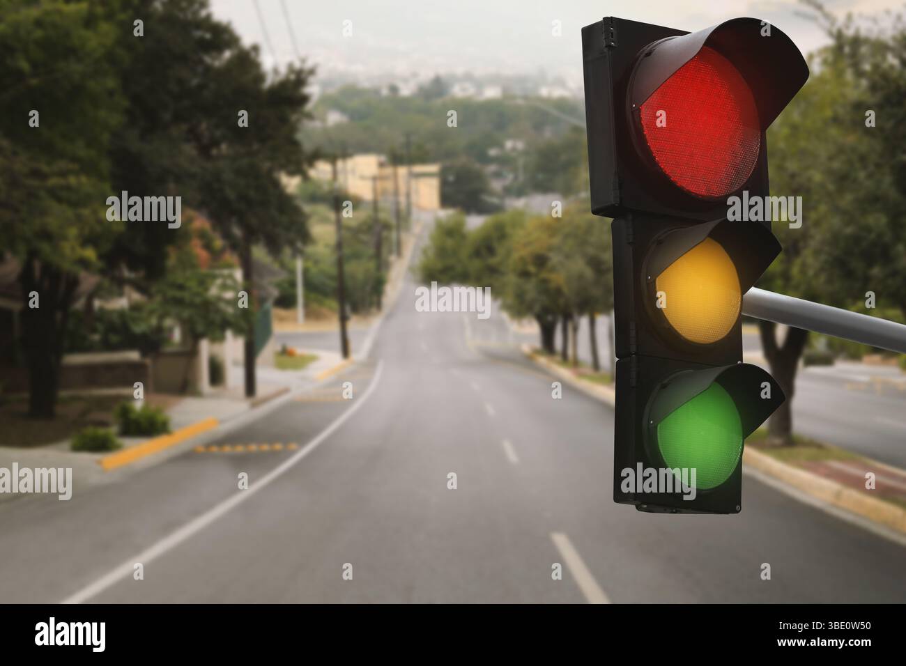Traffic lights on empty road. Signaling device Stock Photo - Alamy