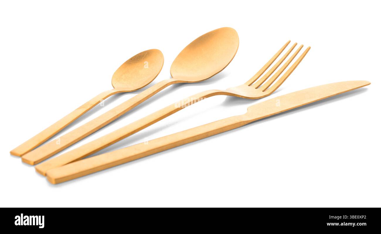 Golden fork, knife and spoons on white background Stock Photo - Alamy