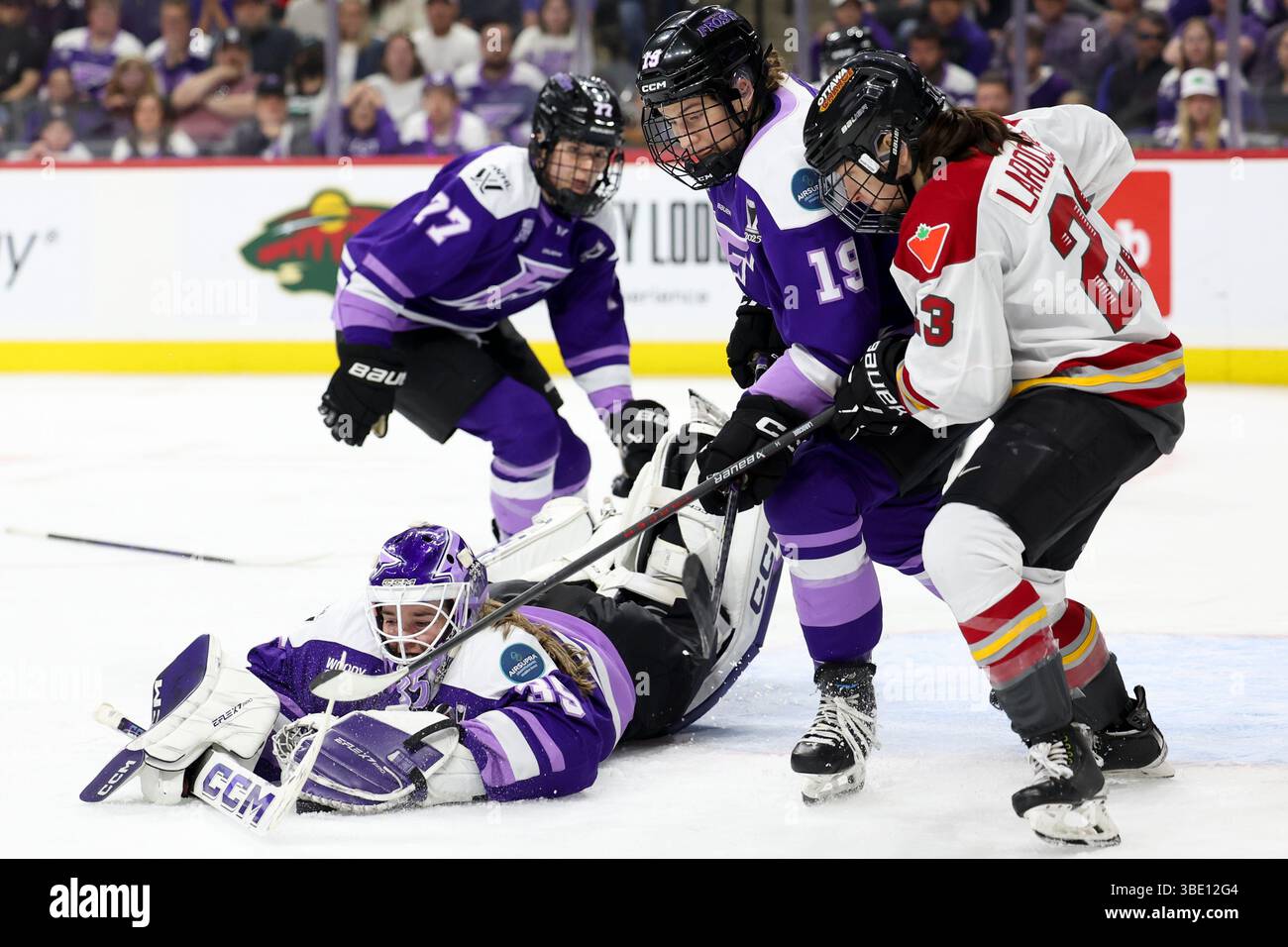 Minnesota Frost goaltender Maddie Rooney (35) dives to save the puck ...