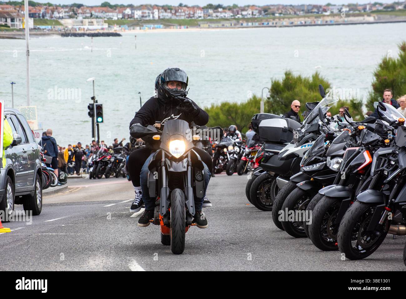 Margate, UK. 26th May, 2025. A biker waves into the camera while he ...