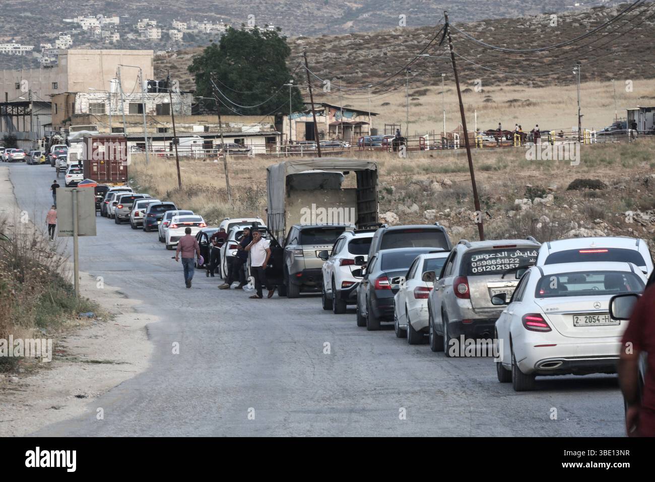 Nablus, Palestine. 26th May, 2025. Palestinians wait at a checkpoint ...