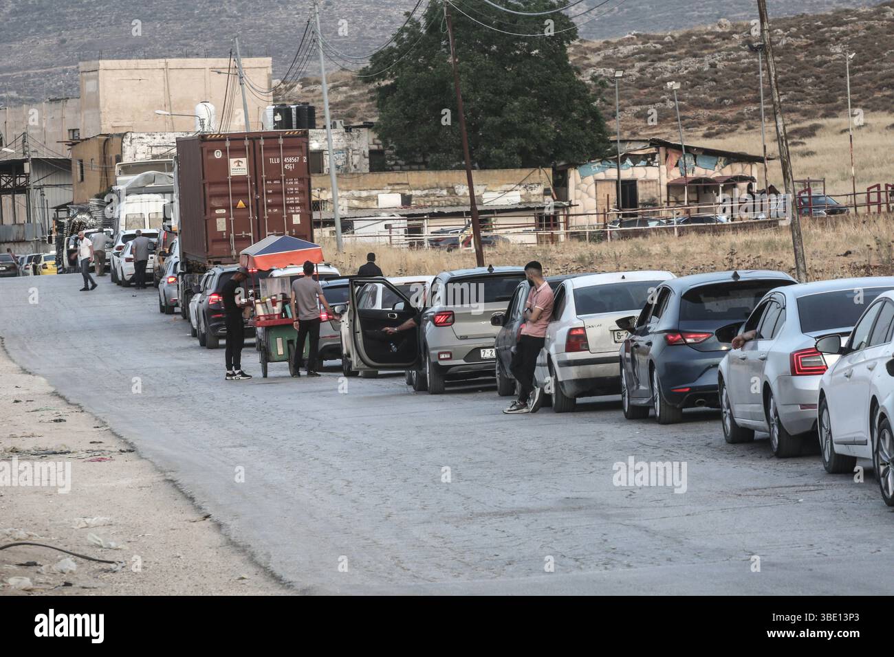 Nablus, Palestine. 26th May, 2025. Palestinians wait at a checkpoint ...