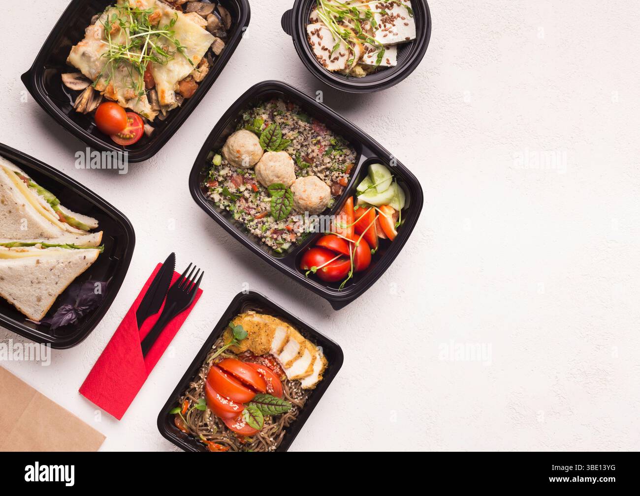 Take away healthy food in black boxes for diet nutrition on white Stock ...