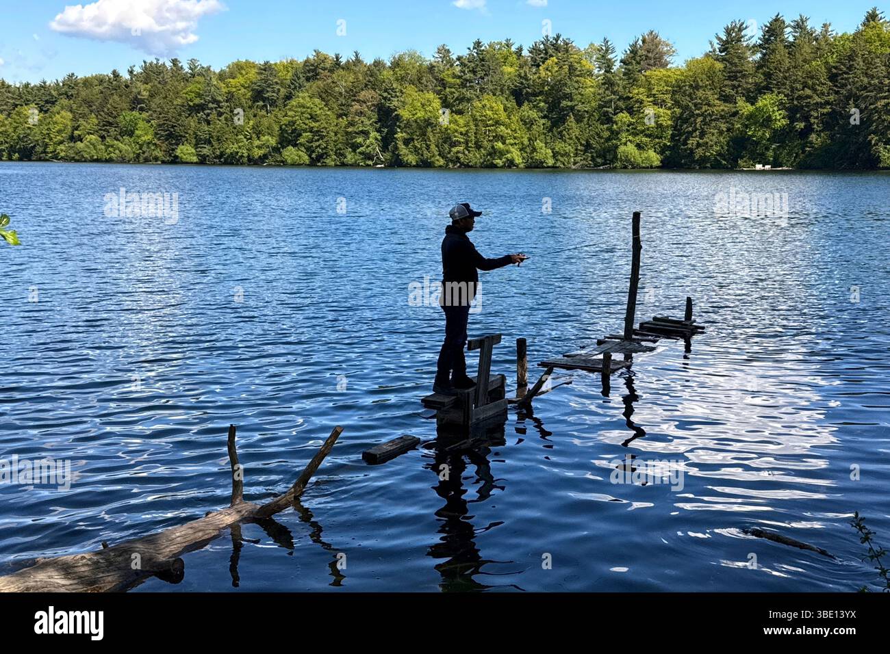 A man enjoys fishing on Bond Lake, north of Toronto, Monday, May 26 ...