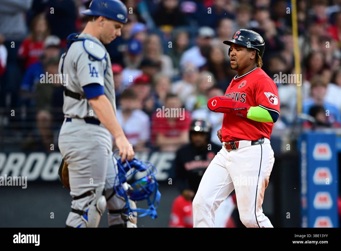 Cleveland Guardians' Jose Ramirez, right, scores after an RBI single by ...