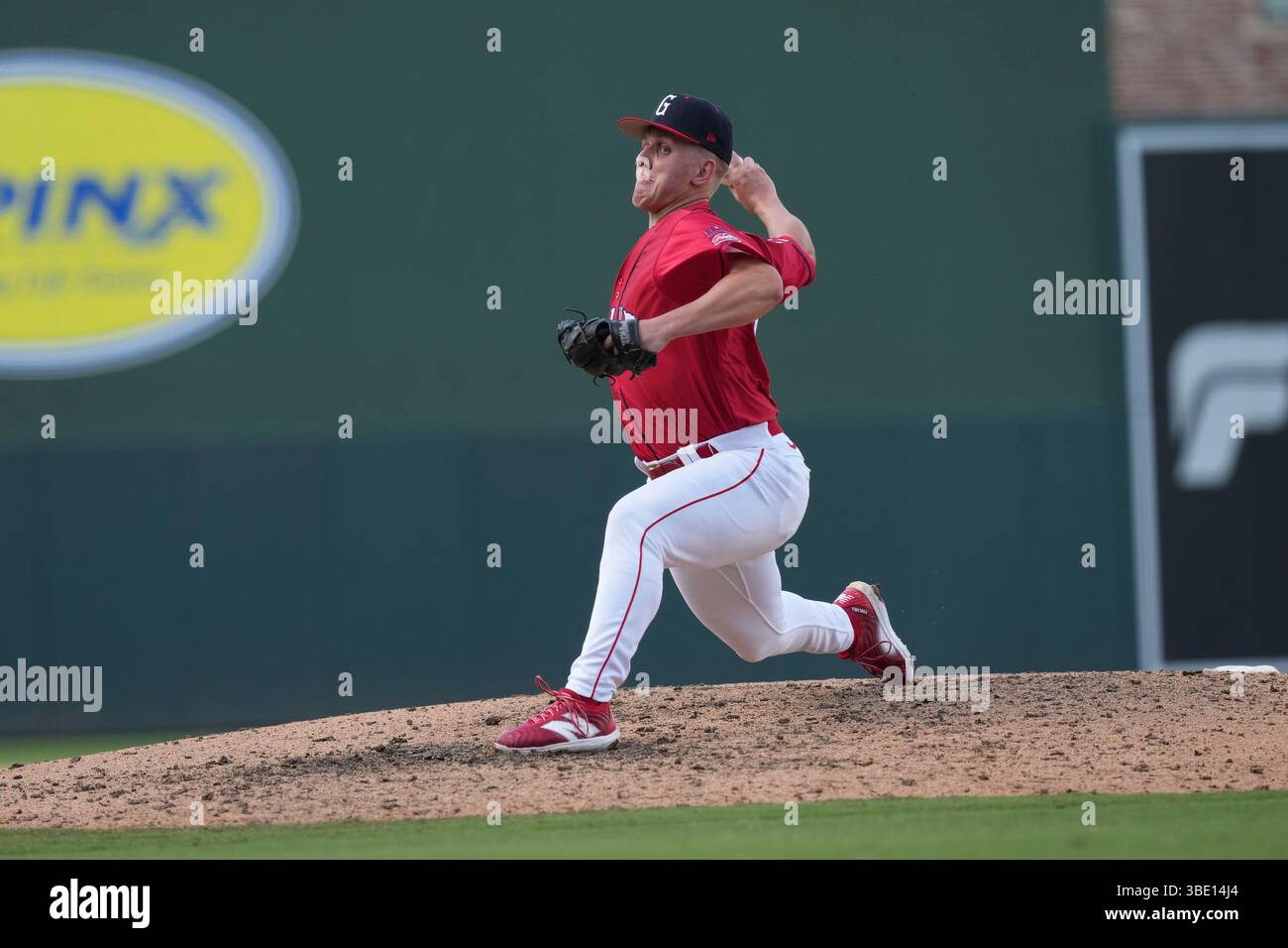 Relief pitcher Isaac Stebens (34) of the Greenville Drive delivers a ...