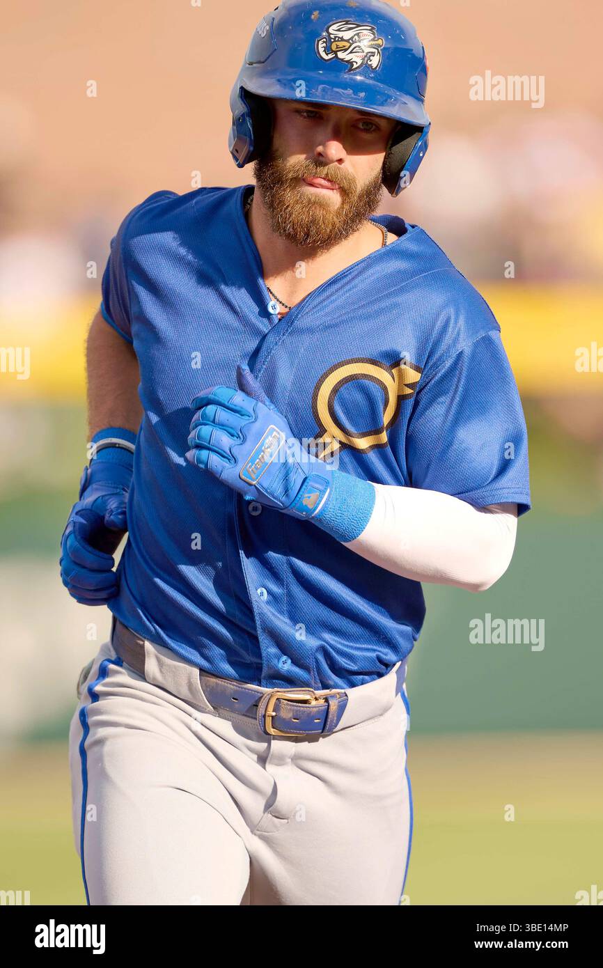 Omaha Storm Chasers center fielder John Rave (2) circles the bases ...