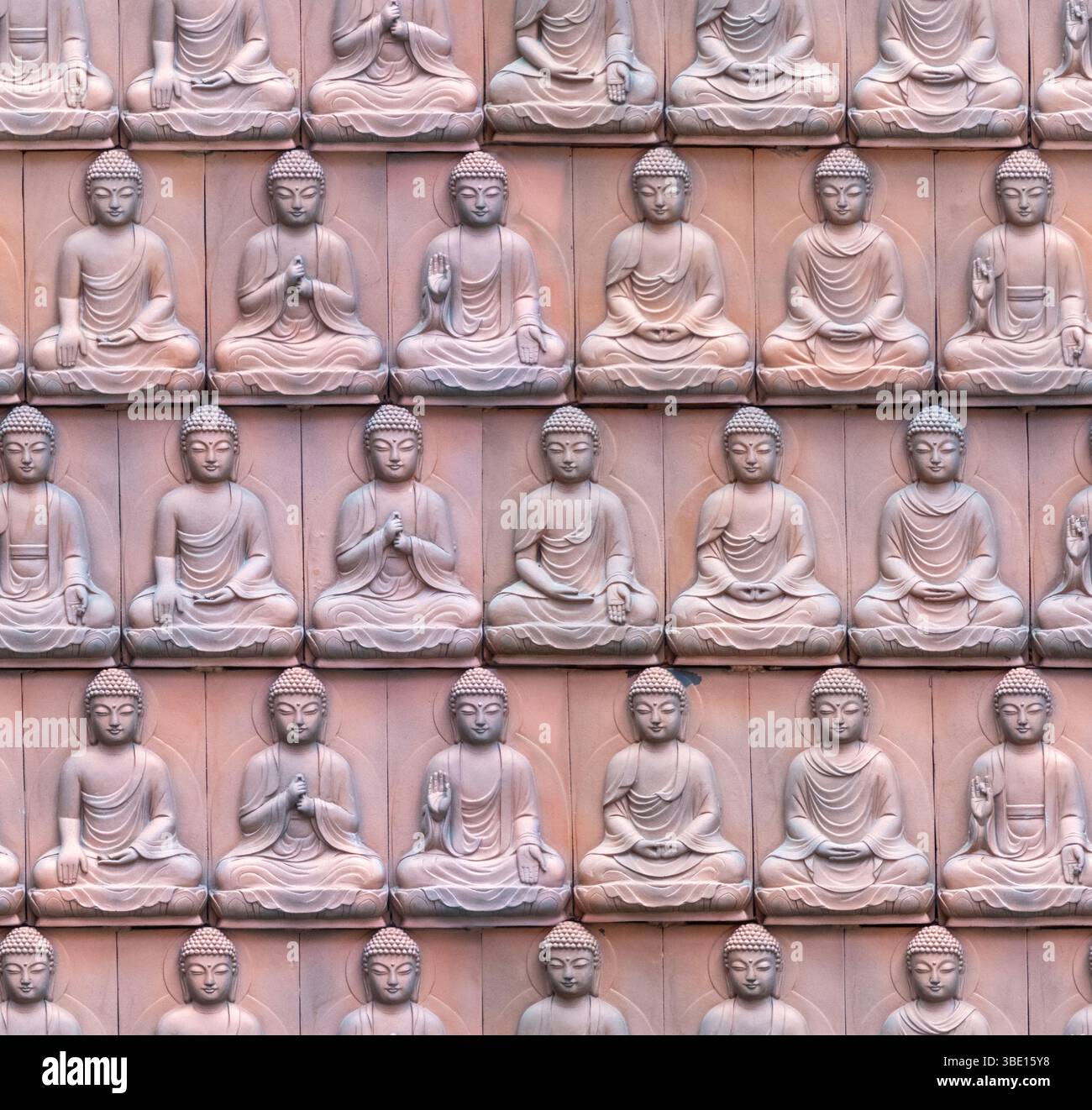 Seamless pattern of Buddha relief sculptures on a temple wall in Seoul ...