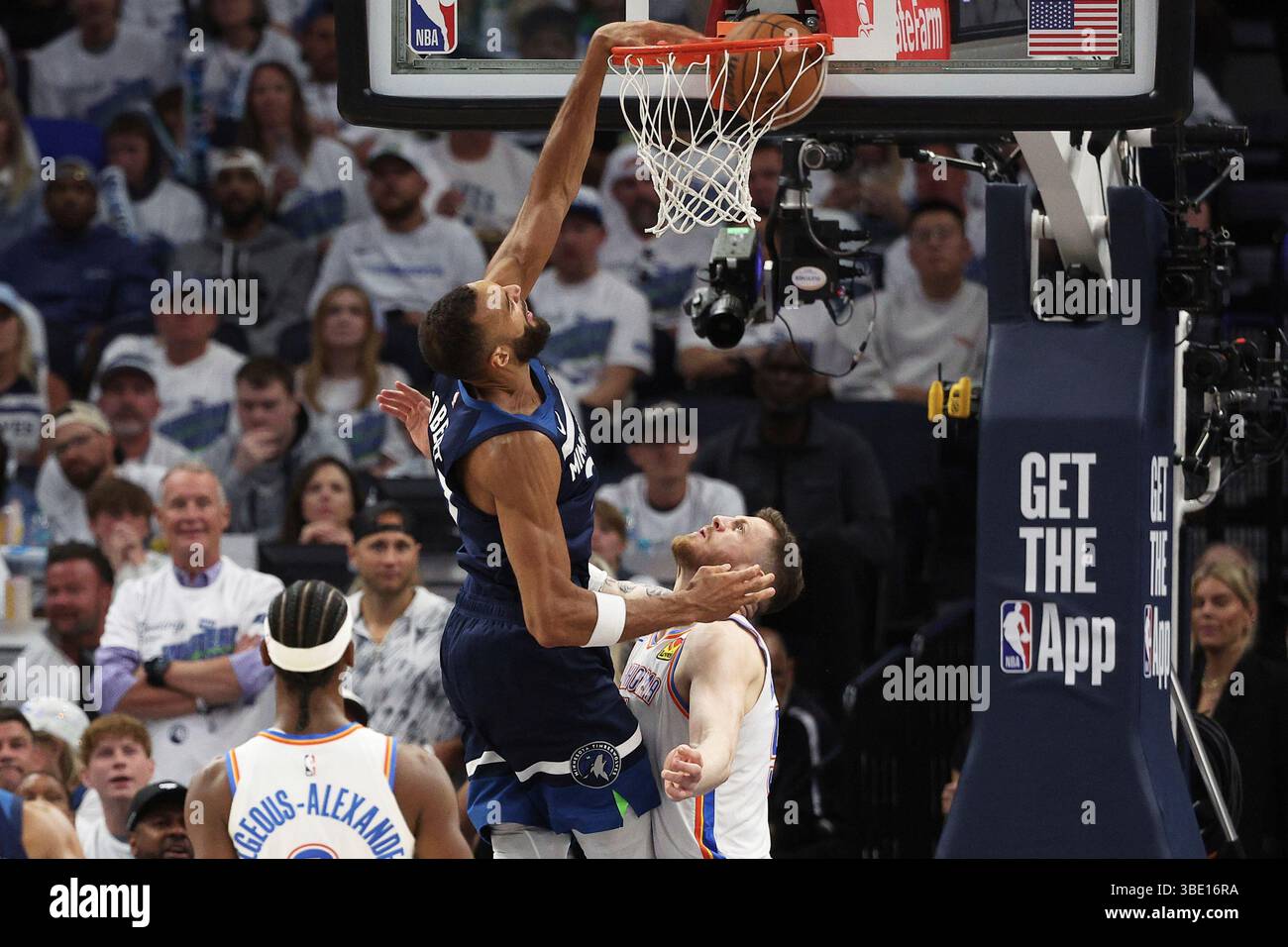 Minnesota Timberwolves center Rudy Gobert, top, dunks over Oklahoma City Thunder center Isaiah ...
