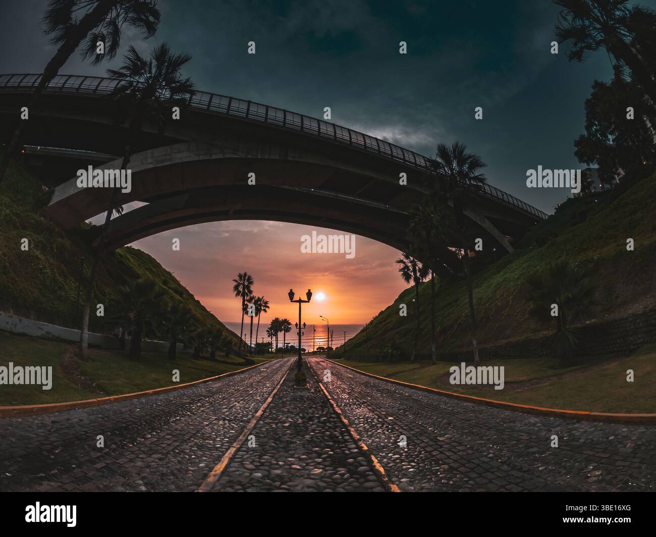 Sunset at Bajada Balta, Miraflores, Lima, Peru with Coastal Bridge and Palm Trees (Horizontal ...