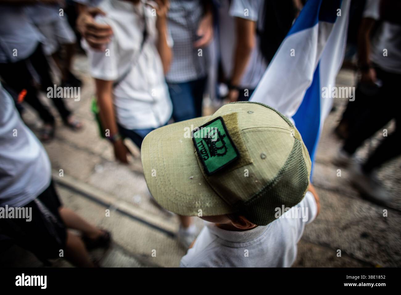 An Israeli child with a Messiah patch on his hat seen during the march ...