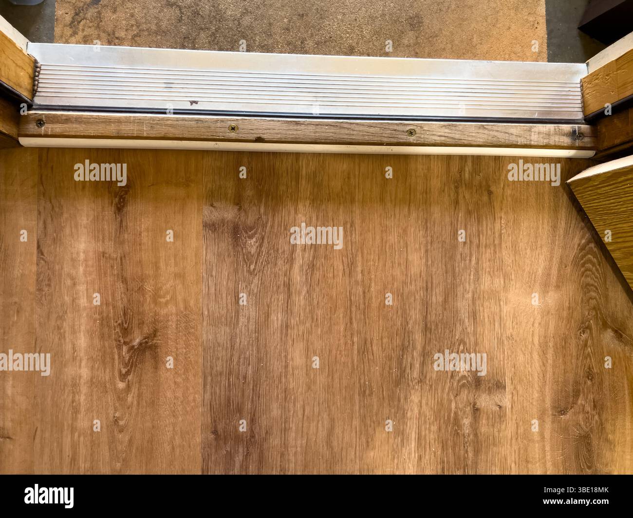 Interior Door Threshold with Wood and Metal Transition Stock Photo - Alamy