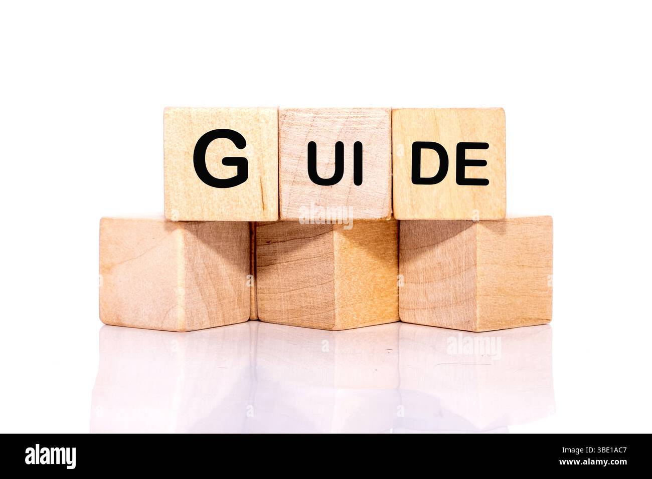GUIDE word concept written on wooden blocks placed on a white ...