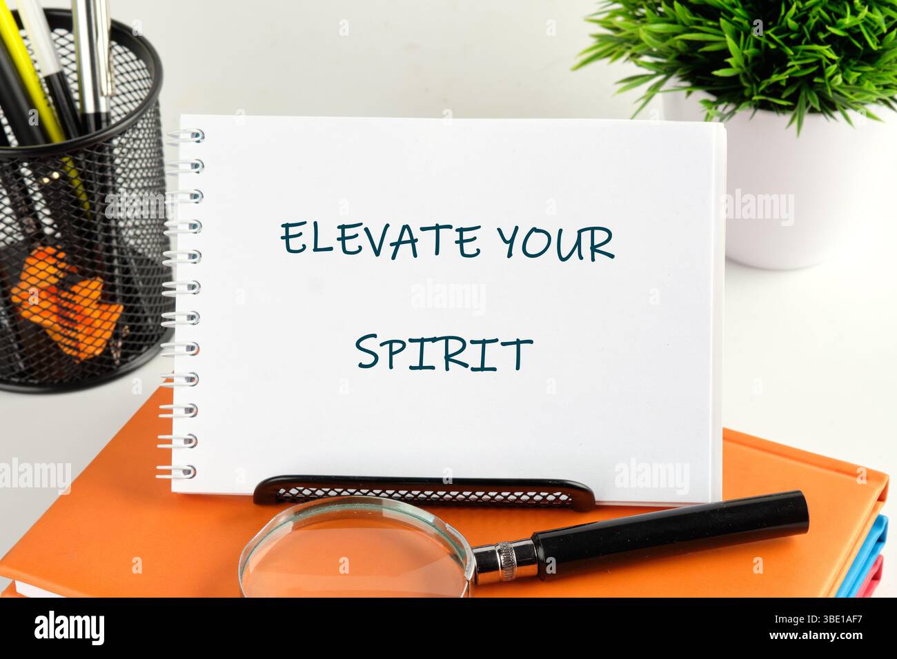 A vibrant workspace showcases a handwritten note stating elevate your ...